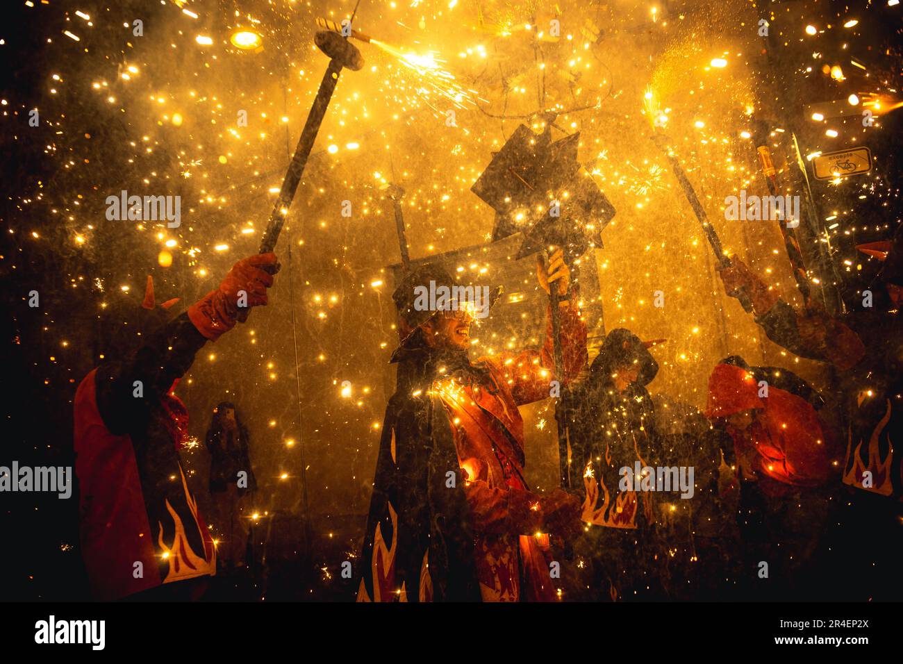 Barcelona, Spain. 27th May, 2023. Fire runners in devil costumes dance ...