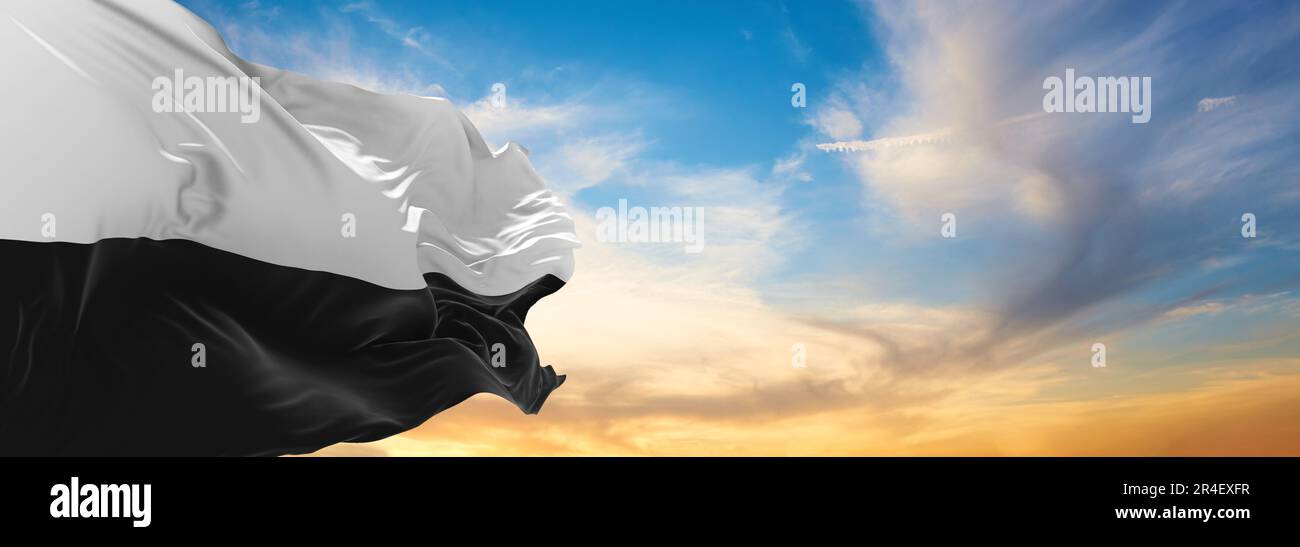 official flag of Pahang Malaysia at cloudy sky background on sunset ...