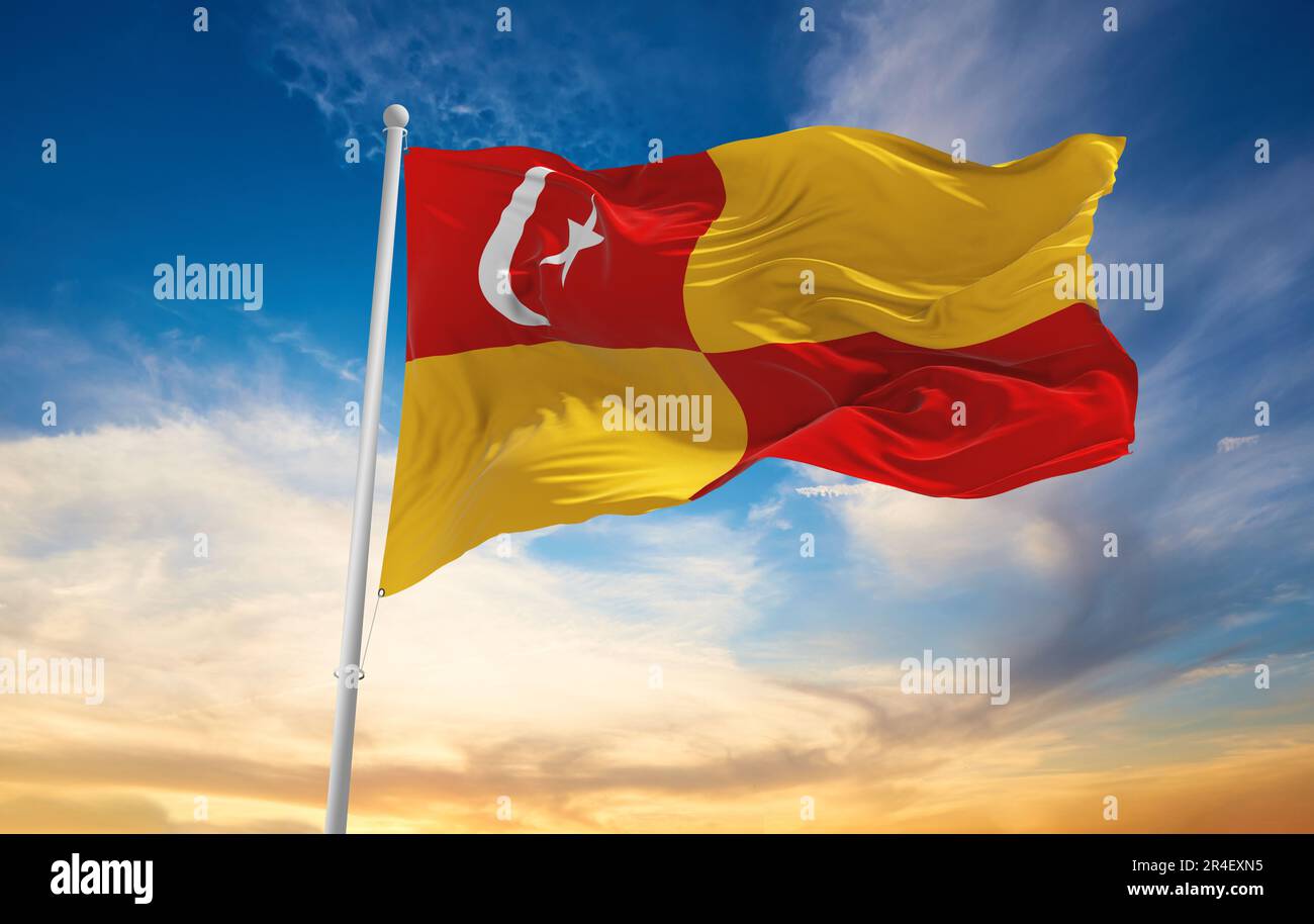 official flag of Selangor Malaysia at cloudy sky background on sunset ...