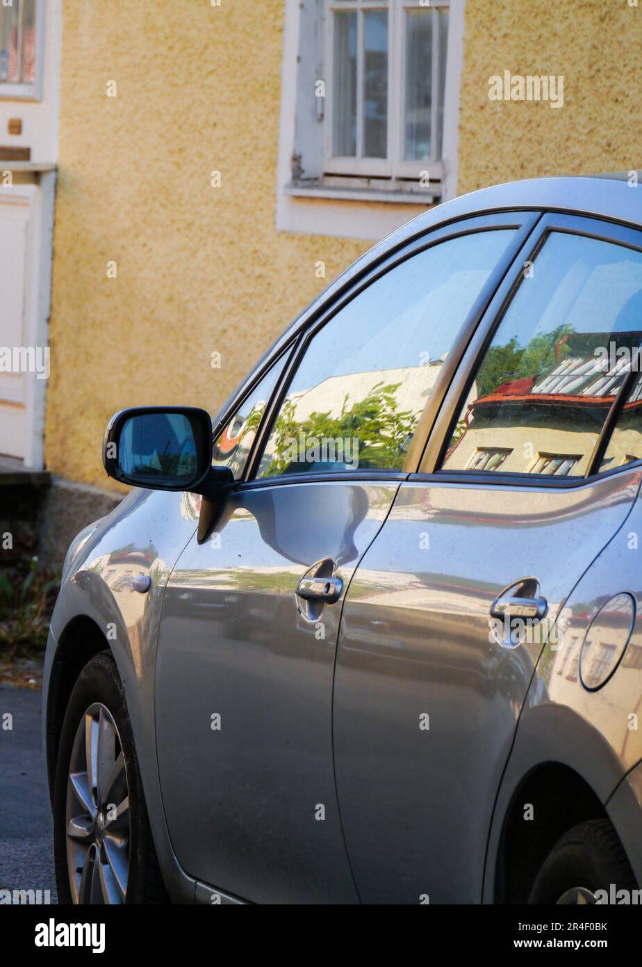 a car parked on the side of a building Stock Photo - Alamy