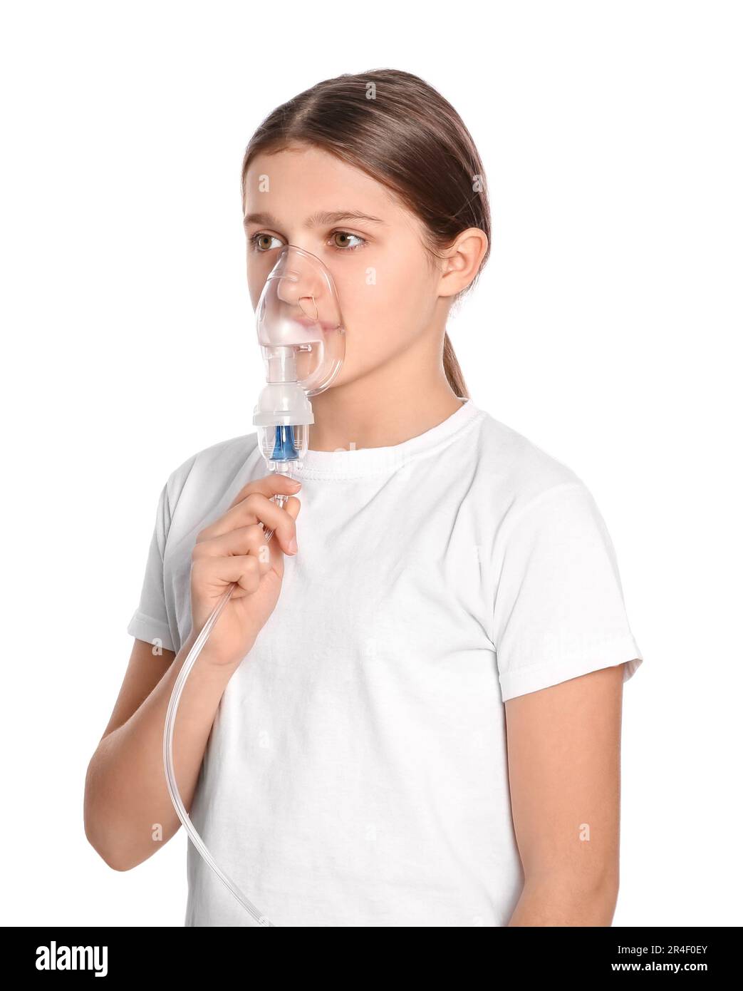 Cute girl using nebulizer for inhalation on white background Stock ...