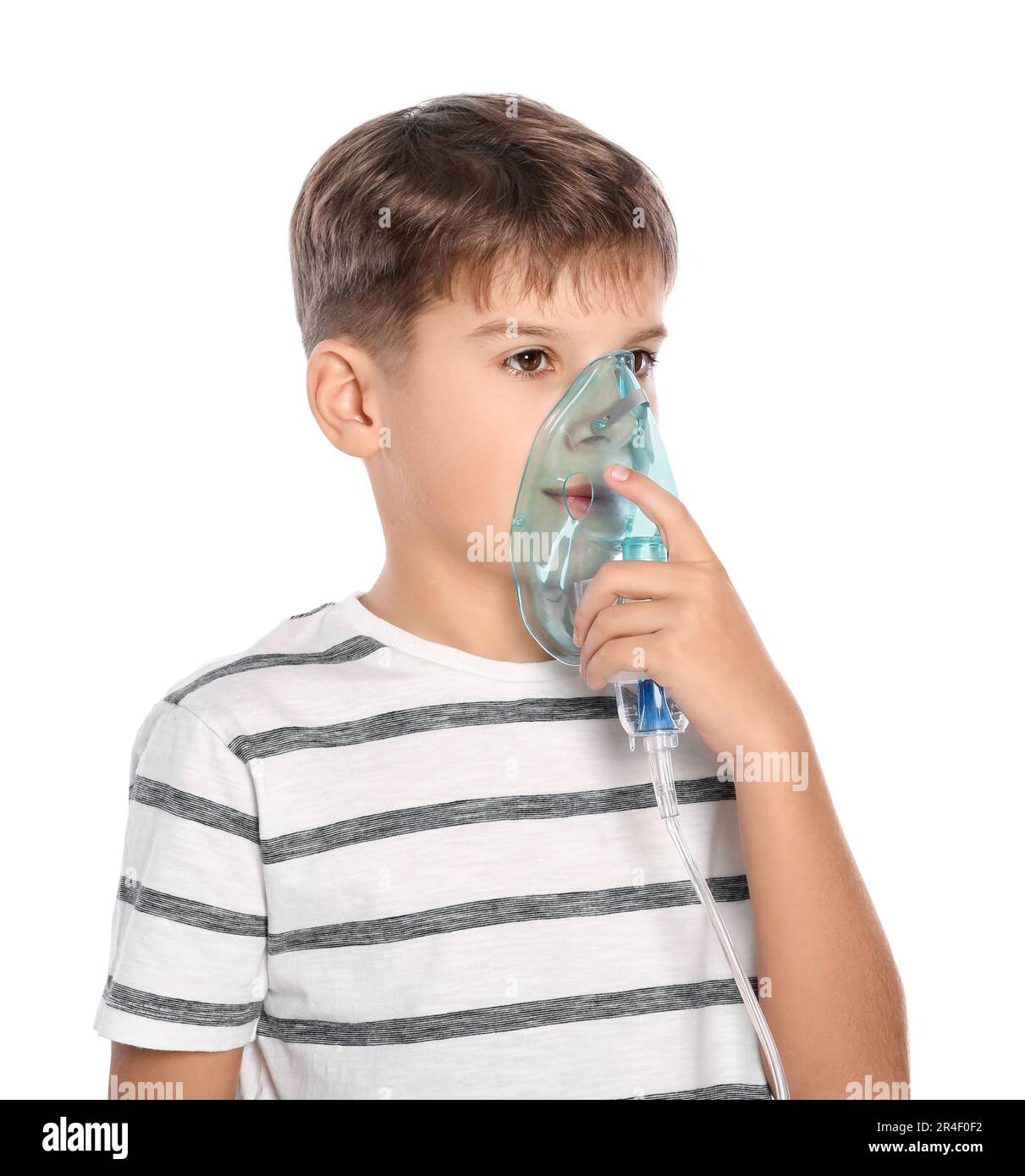 Boy using nebulizer for inhalation on white background Stock Photo - Alamy