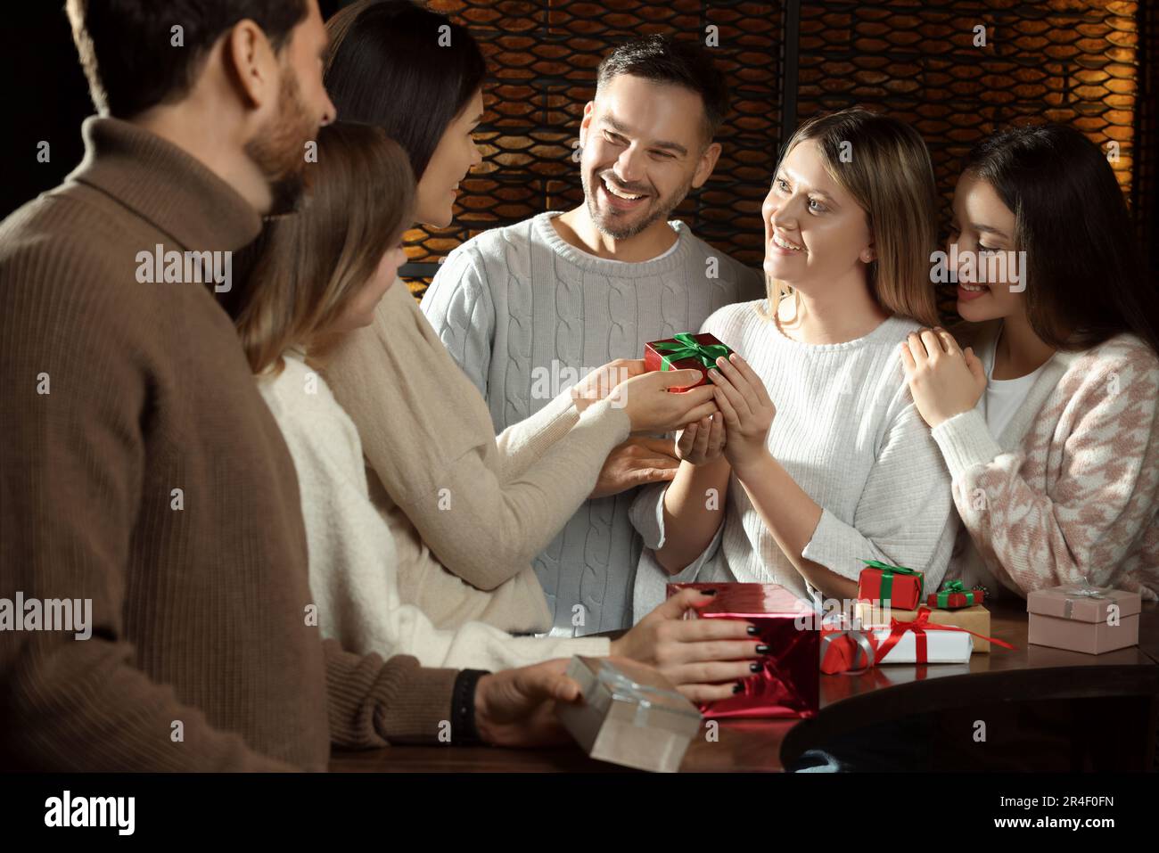 Friends exchanging hi-res stock photography and images - Alamy