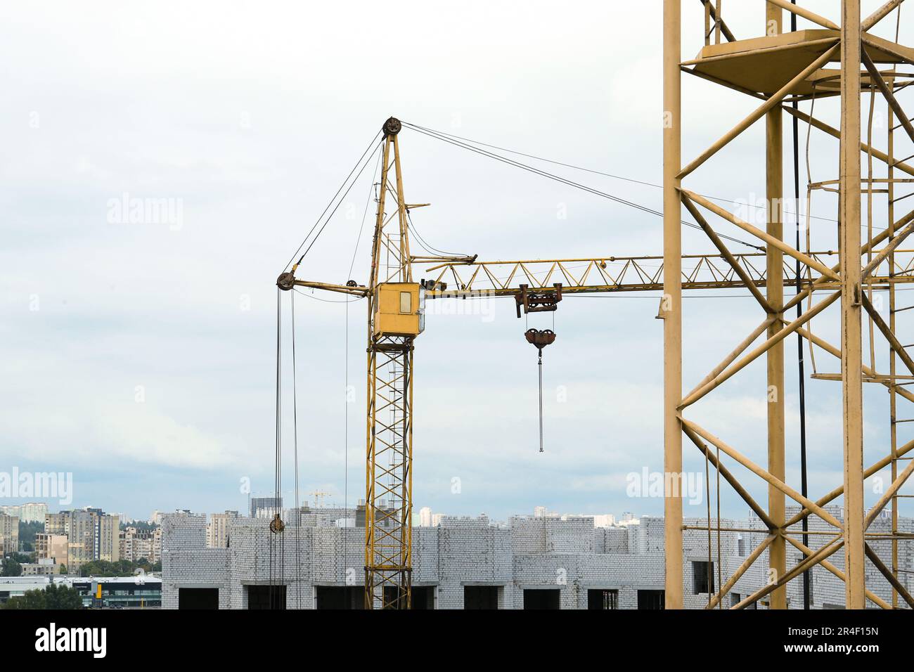 Construction site with tower crane near unfinished building Stock Photo ...