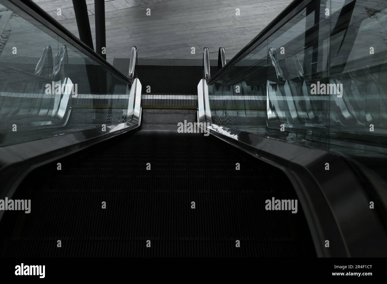 Modern escalator with metal handrails, above view Stock Photo - Alamy