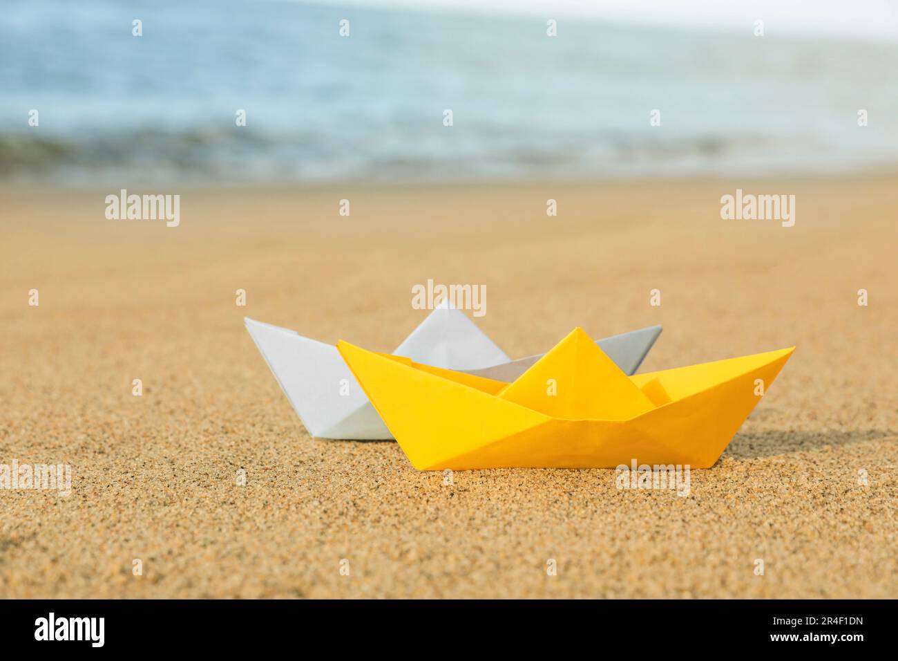 Two white paper boats hi-res stock photography and images - Alamy
