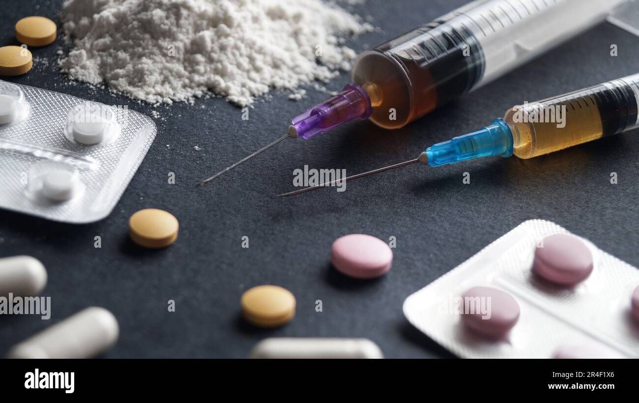 Different hard drugs on black background, closeup Stock Photo - Alamy