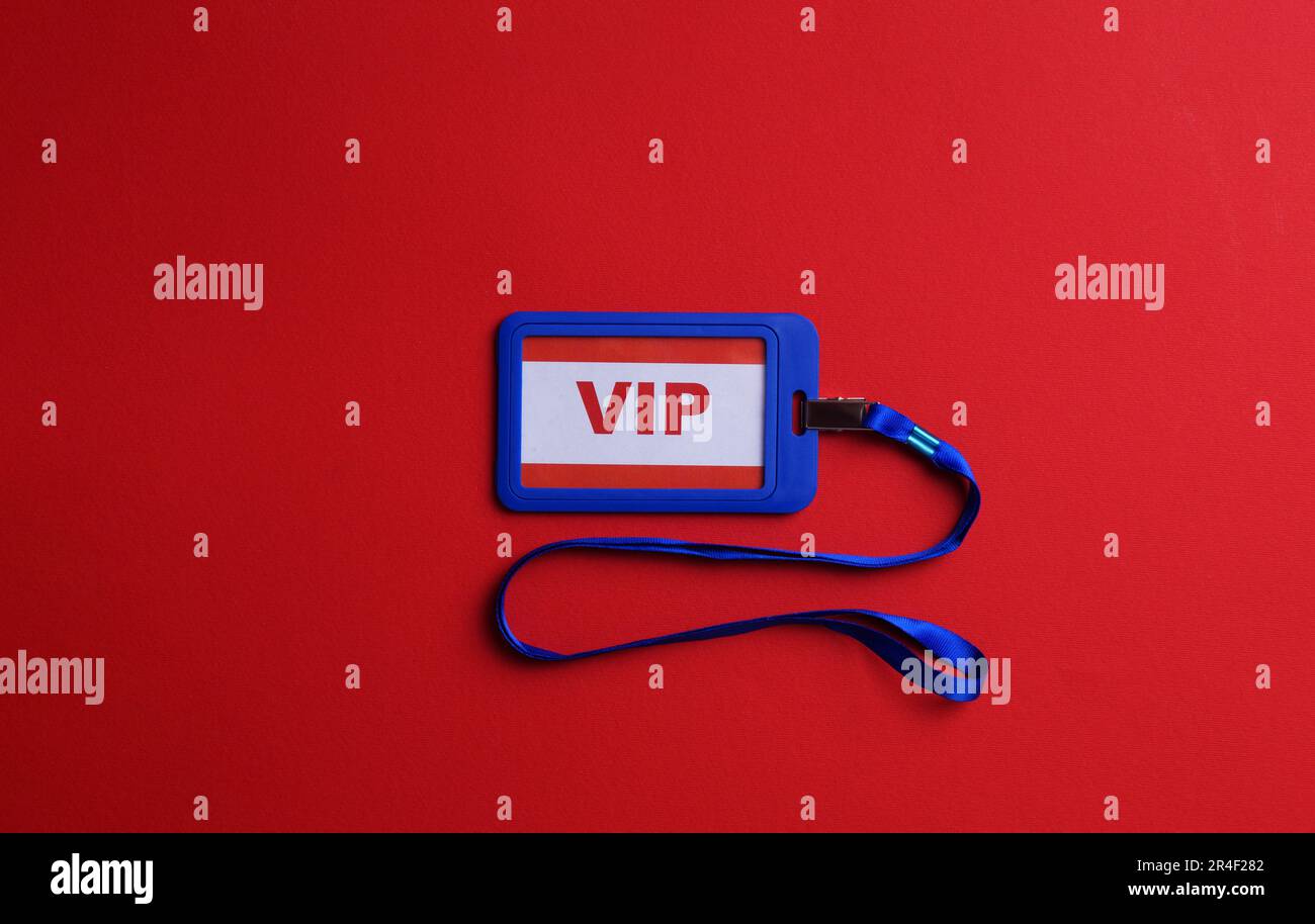 Plastic vip badge on red background, top view Stock Photo - Alamy