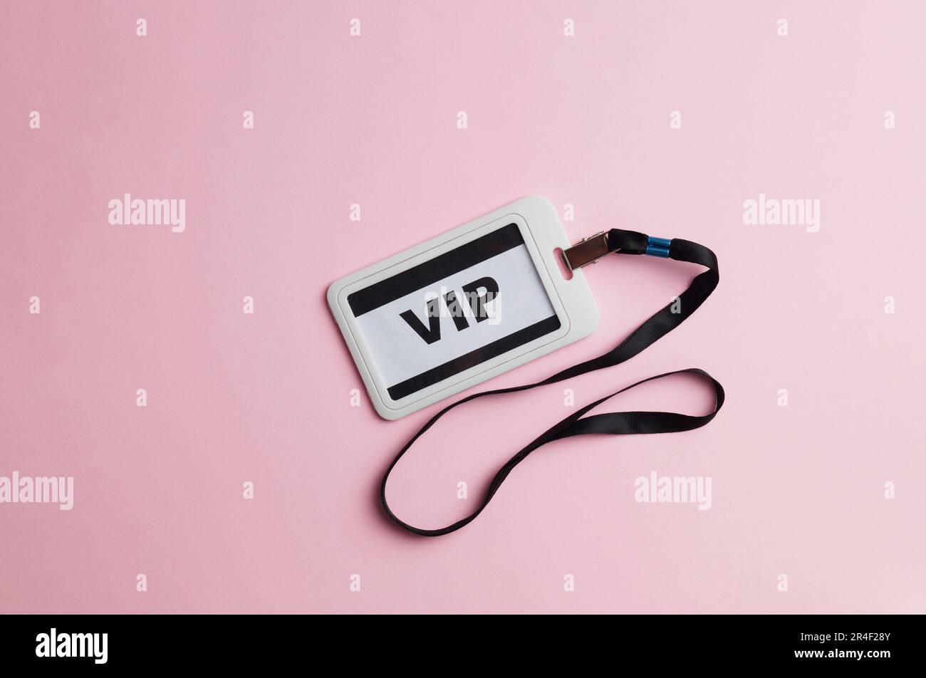 Plastic vip badge on pale pink background, top view Stock Photo - Alamy
