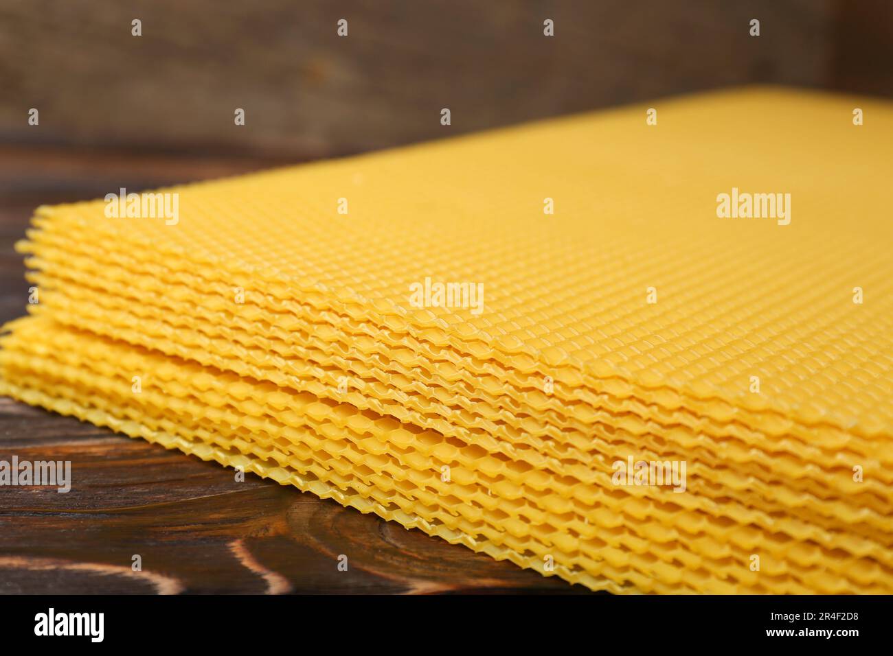 Natural beeswax sheets on wooden table, closeup Stock Photo - Alamy