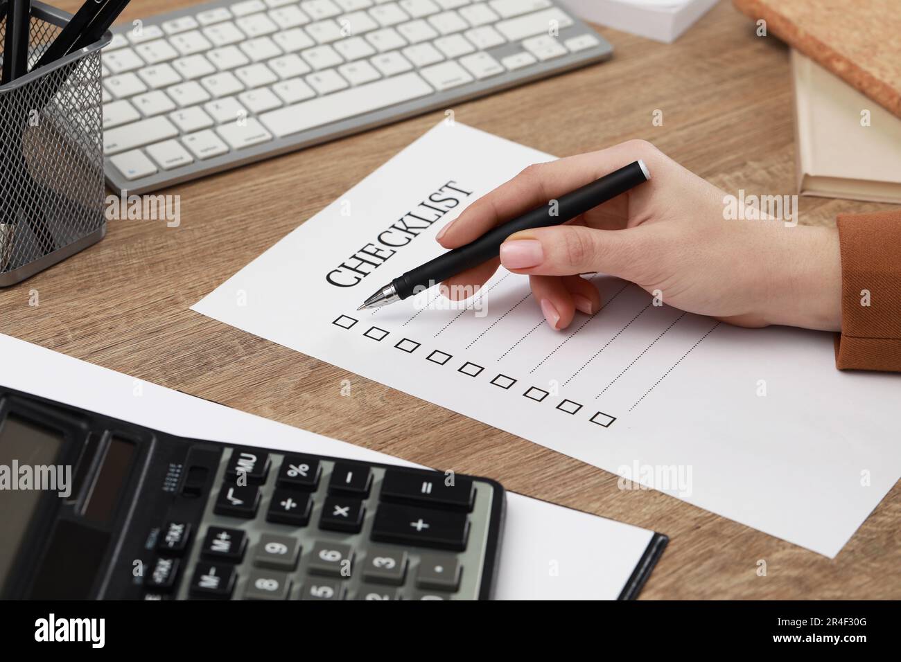 Woman filling checklist table hi-res stock photography and images - Alamy