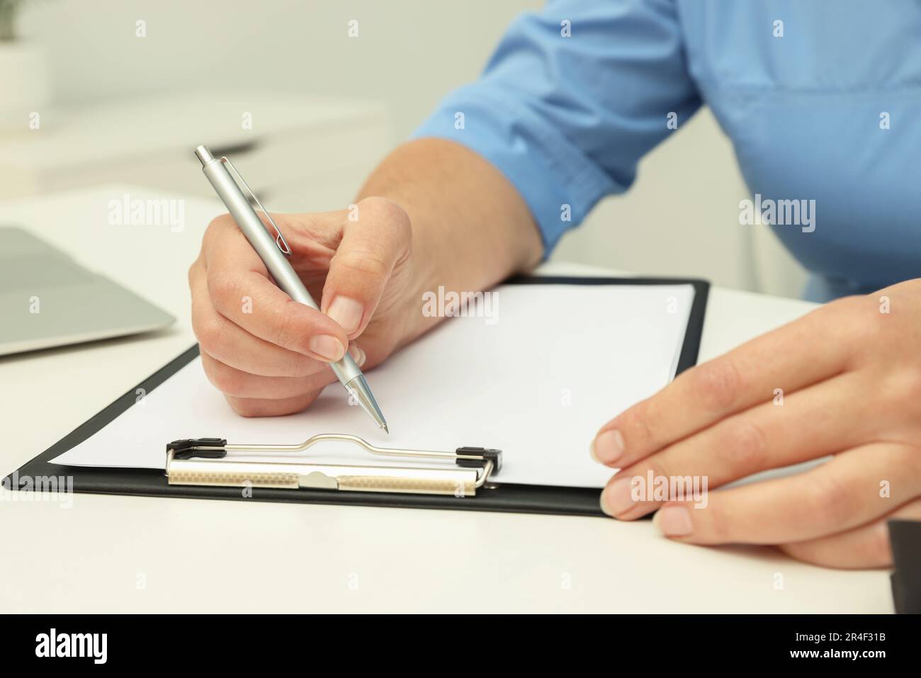 Female hands writing medical report hi-res stock photography and images ...