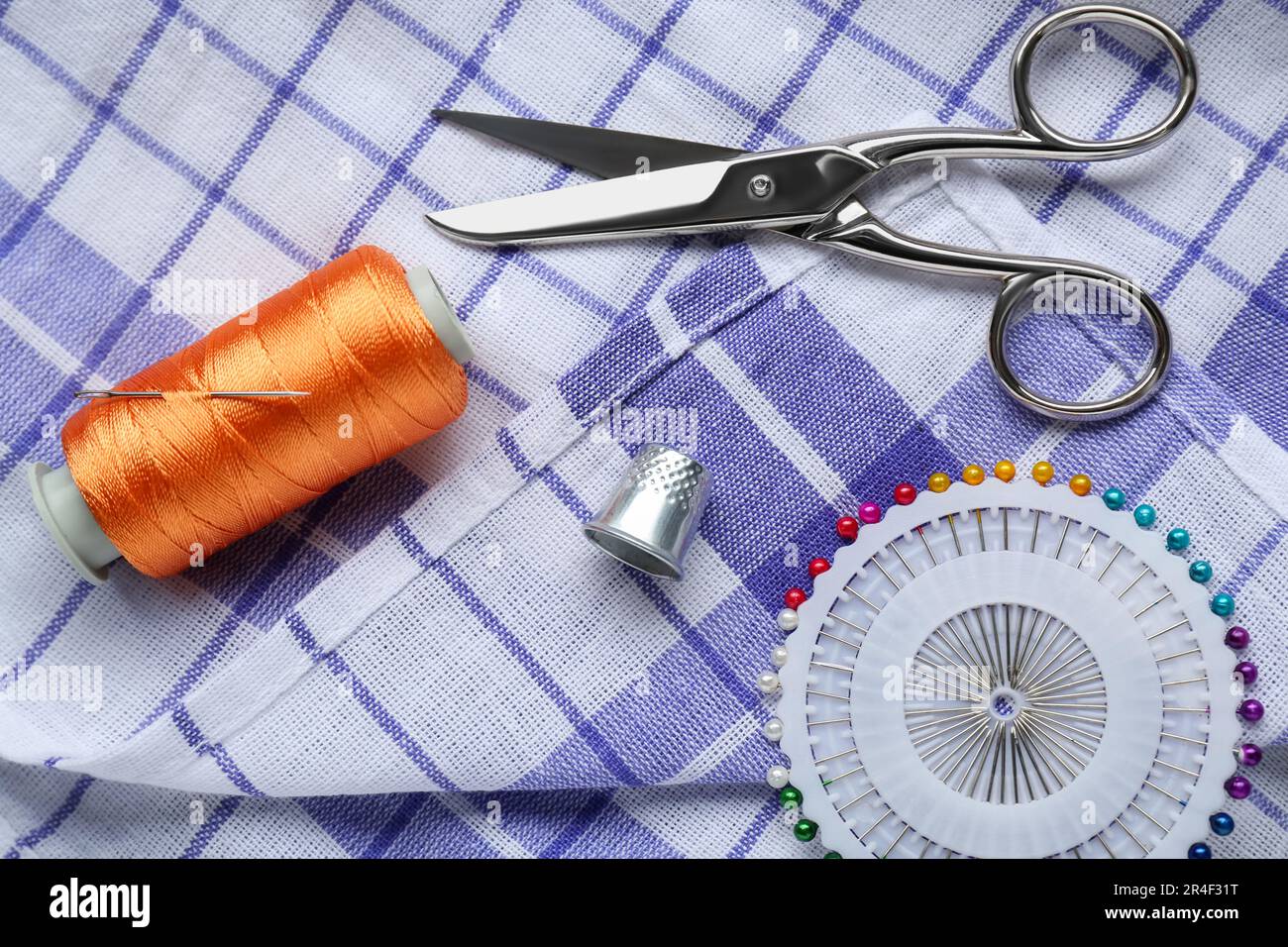 Flat lay composition with thimble and different sewing tools on ...