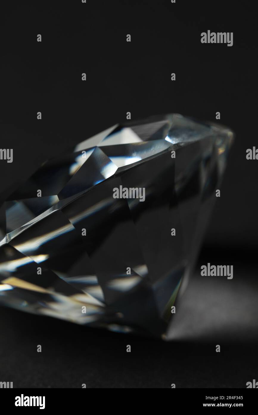 Beautiful dazzling diamond on dark background, closeup. Precious ...