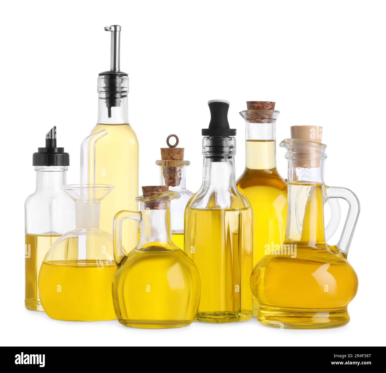Different glass bottles of cooking oil on white background Stock Photo ...