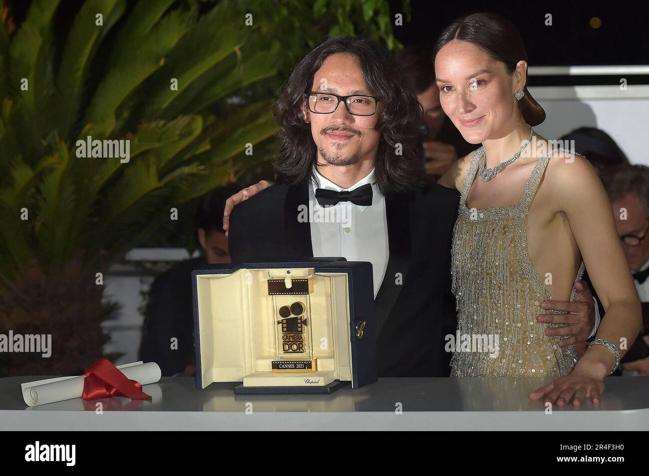 Cannes, France. 27th May, 2023. Director Pham Thien An (L) poses with The Caméra d'or Award for ...