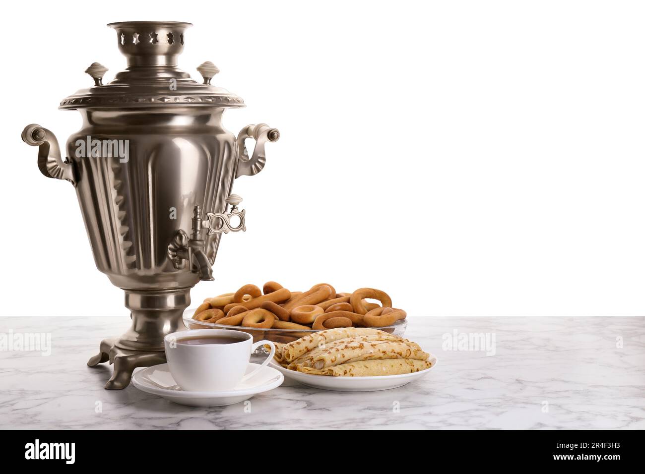 Vintage Samovar Cup Of Hot Drink And Snacks On Marble Table Against