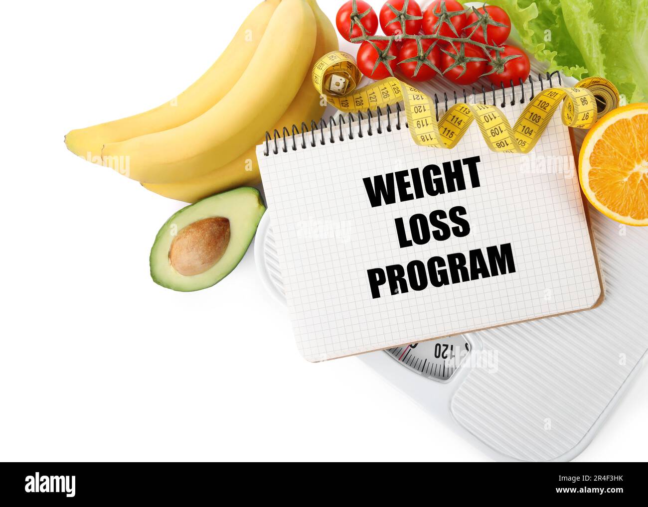 Notebook with phrase Weight Loss Program, measuring tape, scales and ...