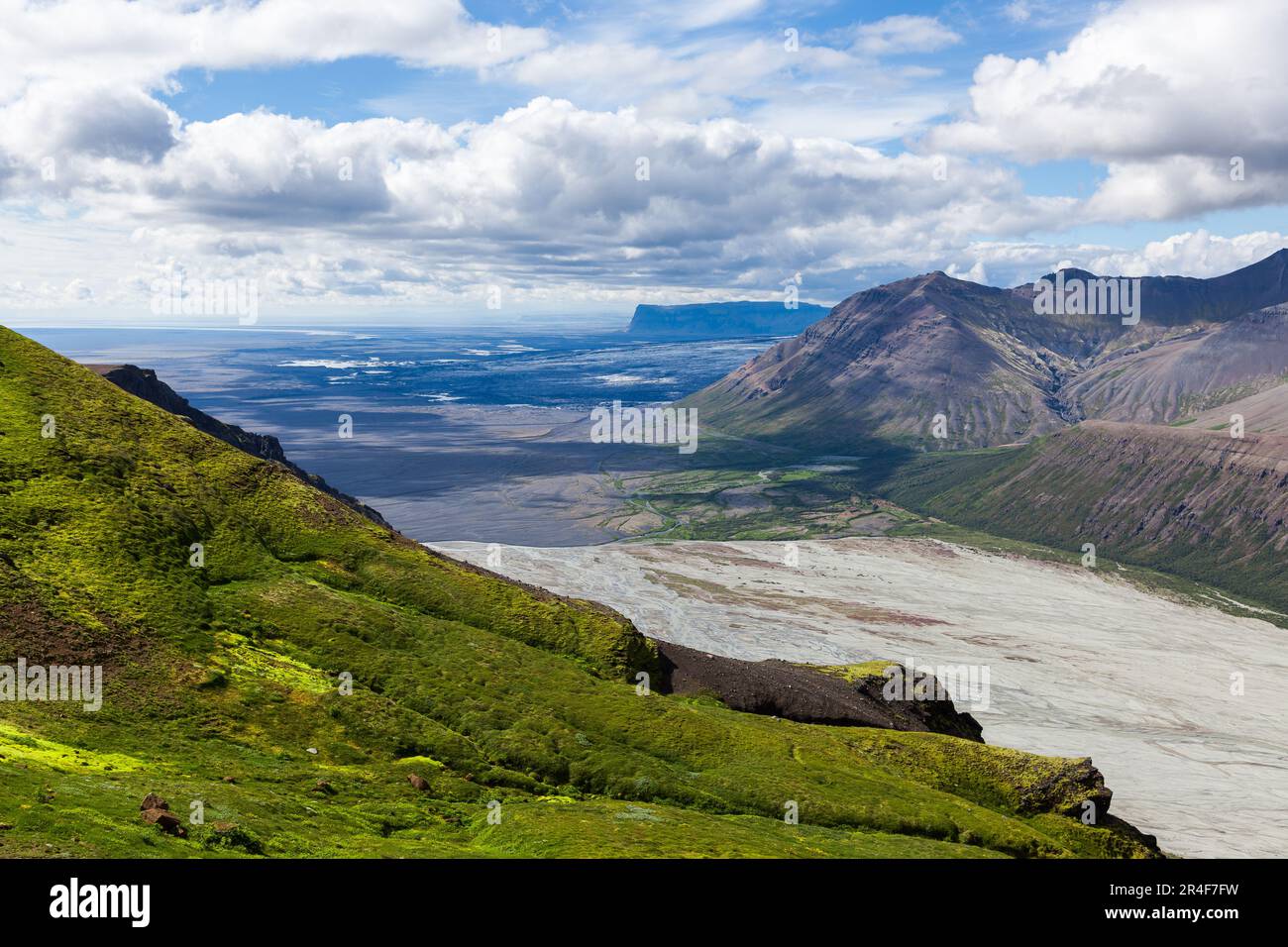 Beautiful Icelandic landscape. Green cliffs and lava fields. Skaftafell ...
