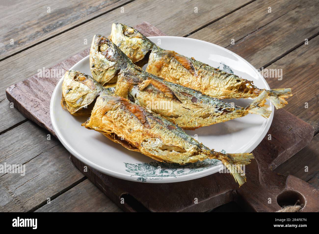 Ikan Mabong goreng or fried Mackerel fish. Fried dry with turmeric ...