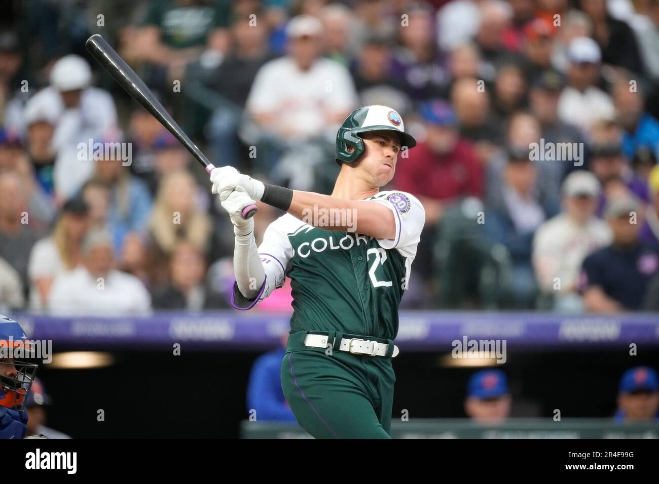 Colorado Rockies' Nolan Jones follows the flight of his RBI-single off ...