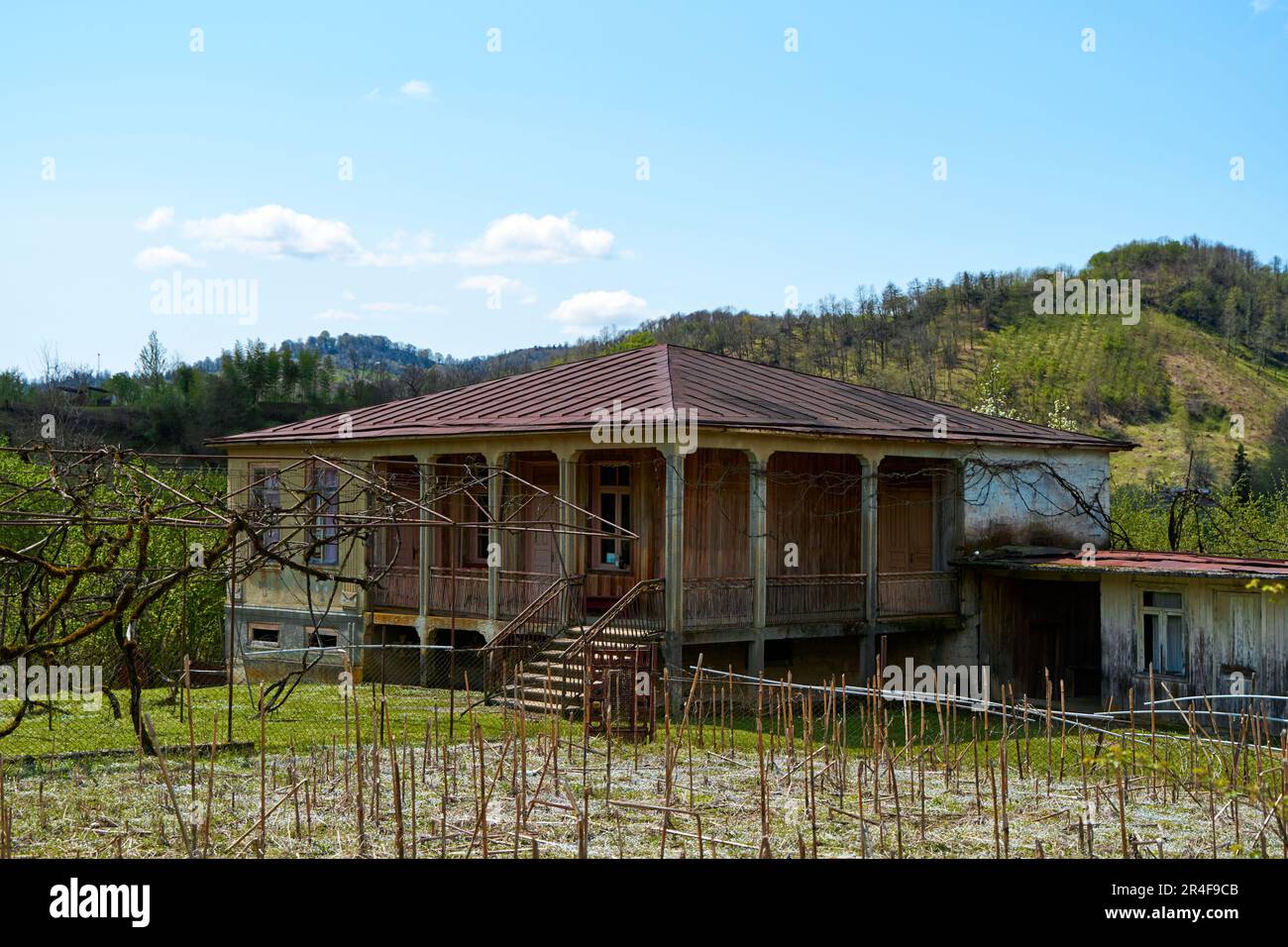 Detached old two-story wooden house. Traditional Georgian house in the ...