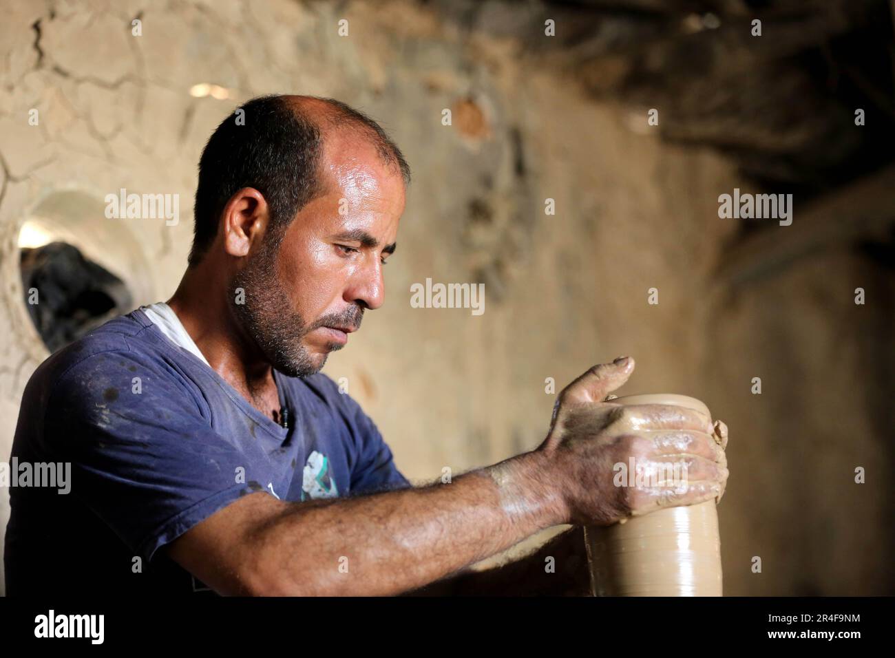 Baghdad, Iraq. 27th May, 2023. Safaa al-Kawaz, a pottery workshop owner ...