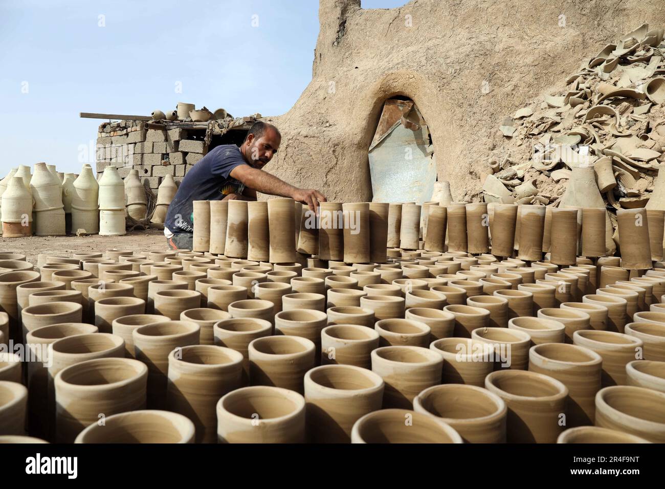 Baghdad, Iraq. 27th May, 2023. Safaa al-Kawaz, a pottery workshop owner ...