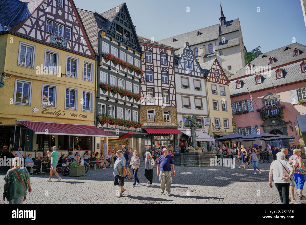 Tourists enjoying the medieval old market square in the center of ...
