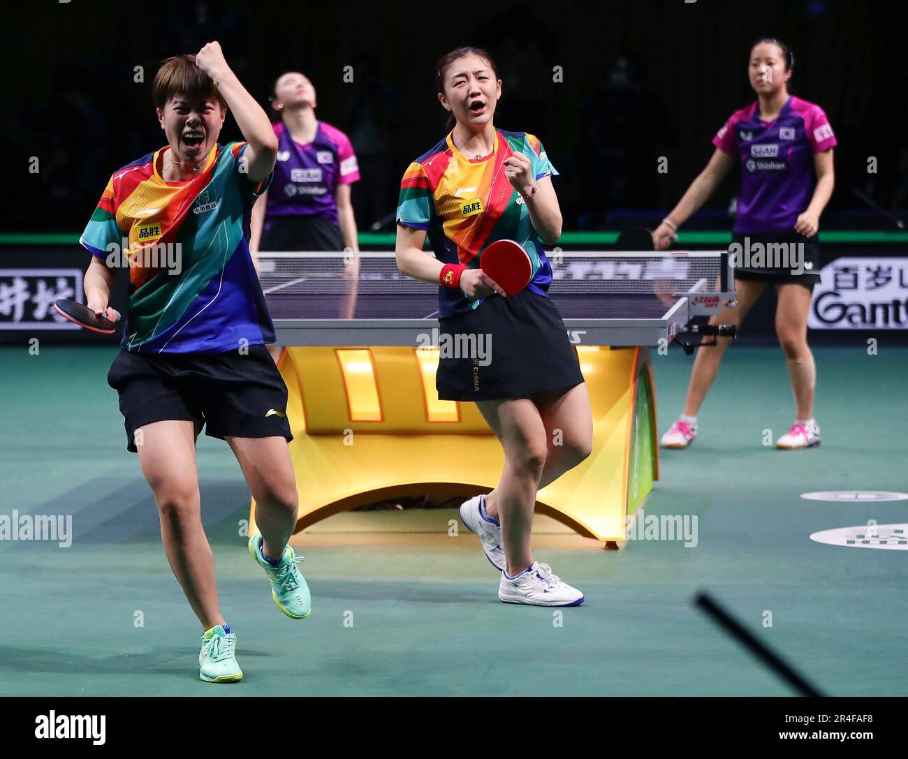Durban, South Africa. 27th May, 2023. Chen Meng/Wang Yidi (L) of China celebrate scoring during ...