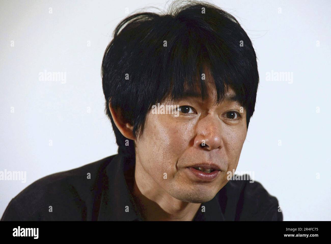 FILE: Japanese screenwriter Yuji Sakamoto speaks during an interview in ...