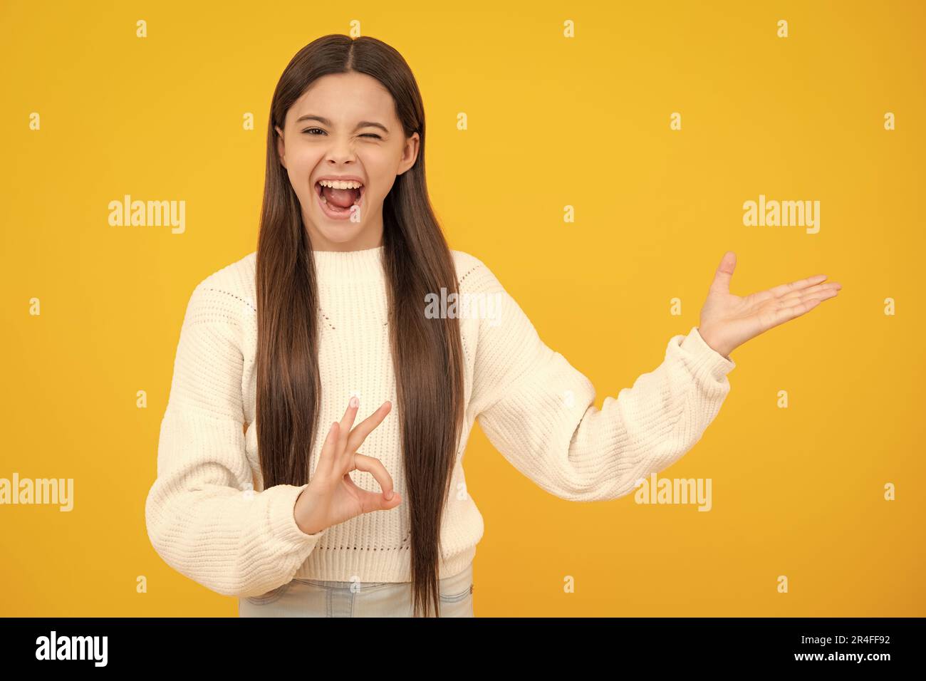 Look at advert. Teenager child points aside shows blank copy space for ...