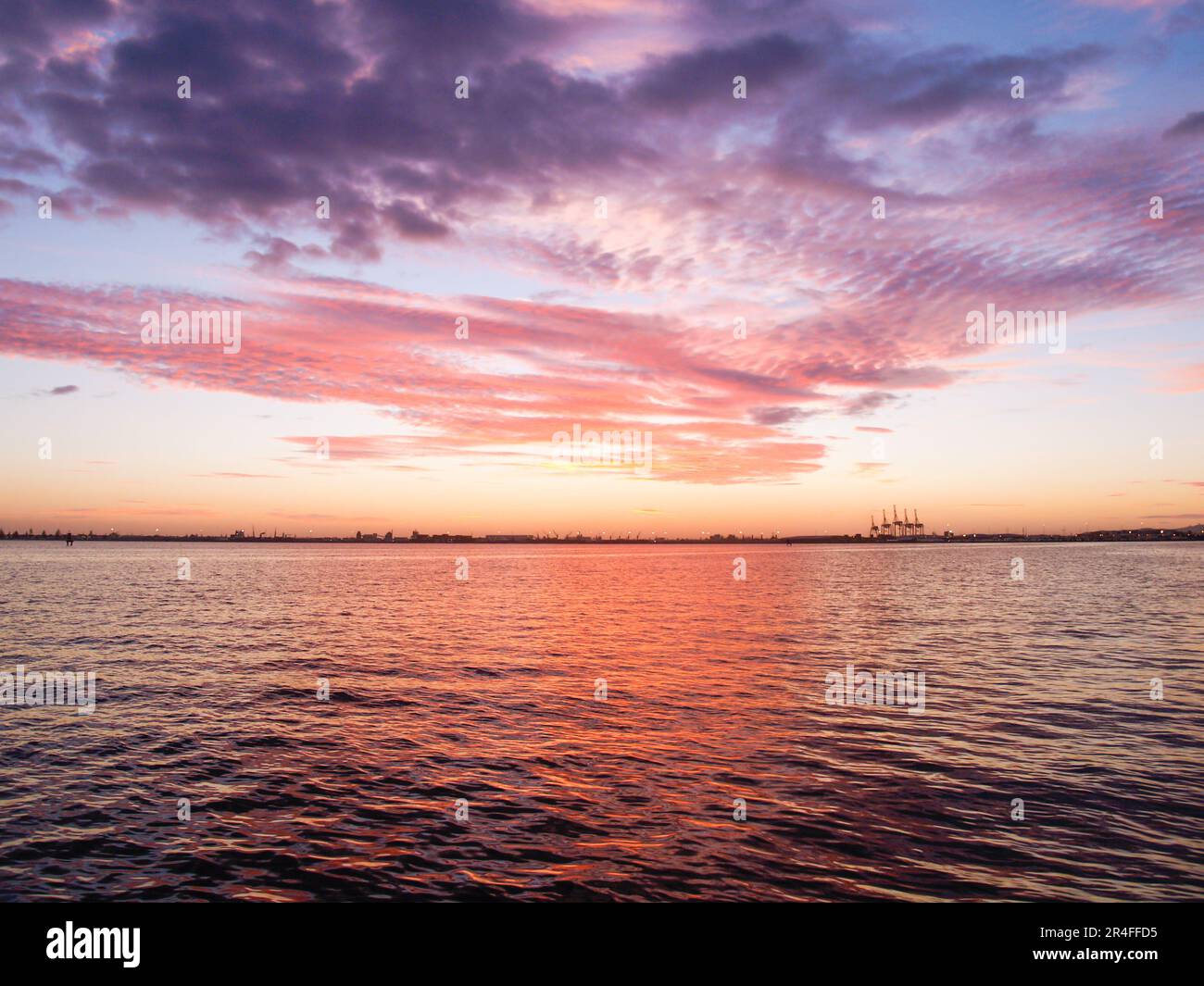 Impact of brilliant morning sunrise over Tauranga Harbour Stock Photo ...