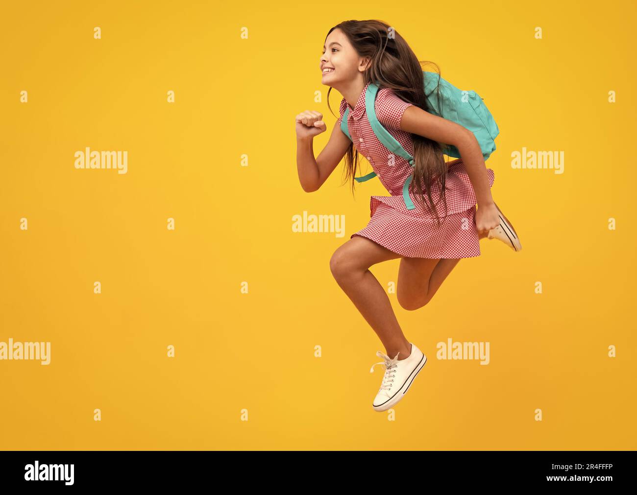 Back to school. Teenage school girl ready to learn. Crazy run and jump ...