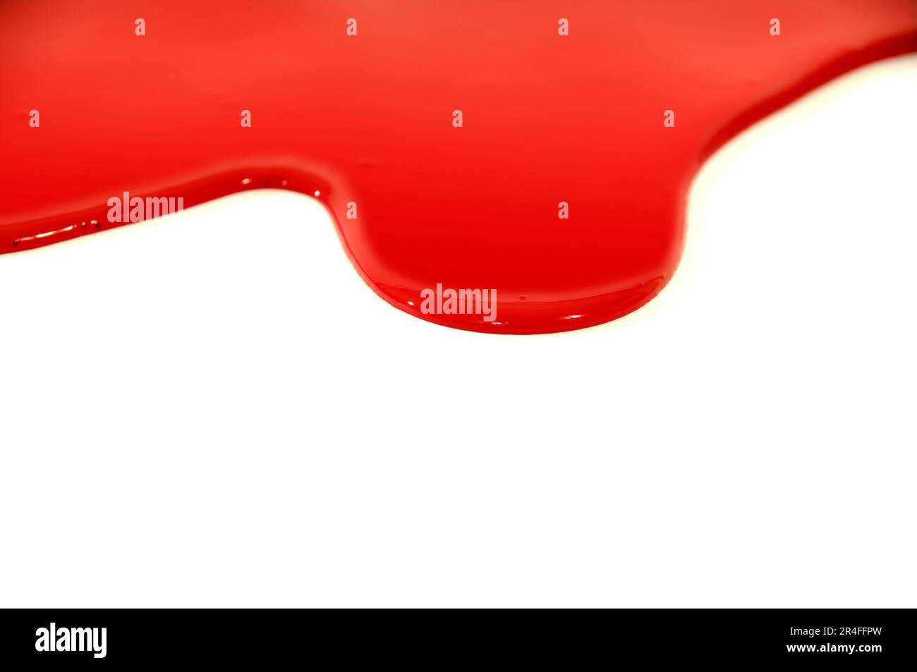 Red paint is flowing down a white background Stock Photo - Alamy