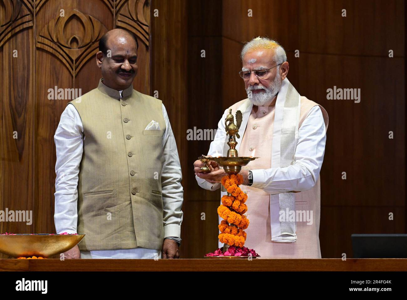 Indian prime minister Narendra Modi lights a lamp after installing a ...