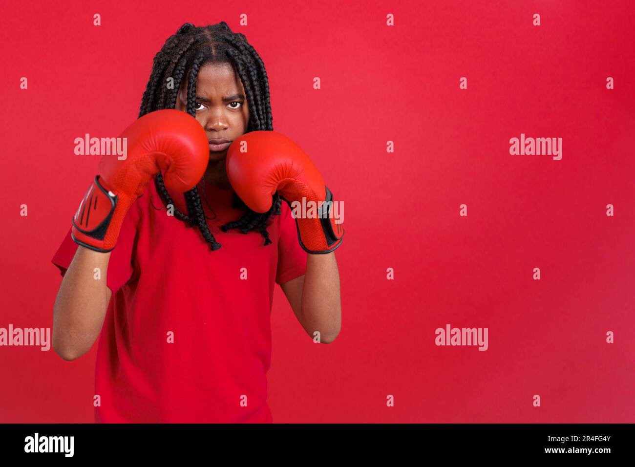 African woman with boxing gloves in fight pose Stock Photo - Alamy