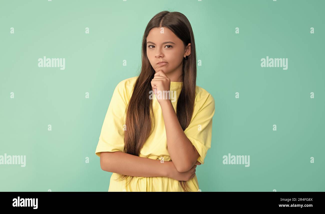 pondering kid with long hair. beauty and fashion. female fashion model ...