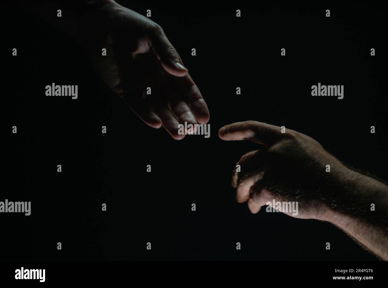 Men holding hands isolated on black. Connection and human relations ...