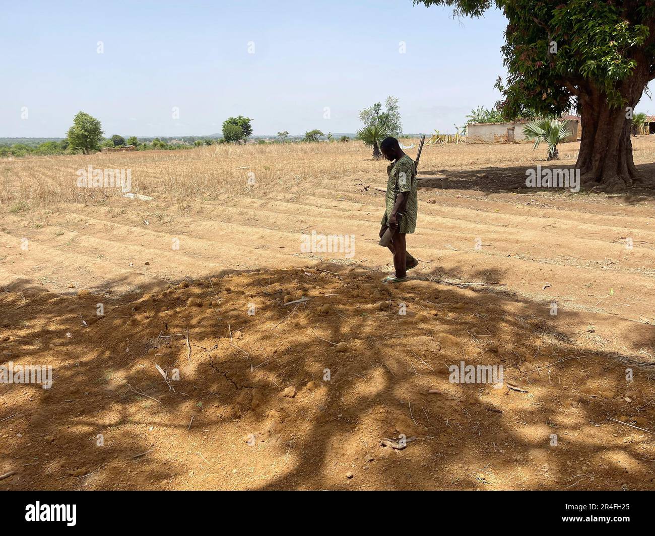 Danjuma Joshua, 36, walks by his two daughters graves in Kunji, Southern Kaduna Nigeria ...