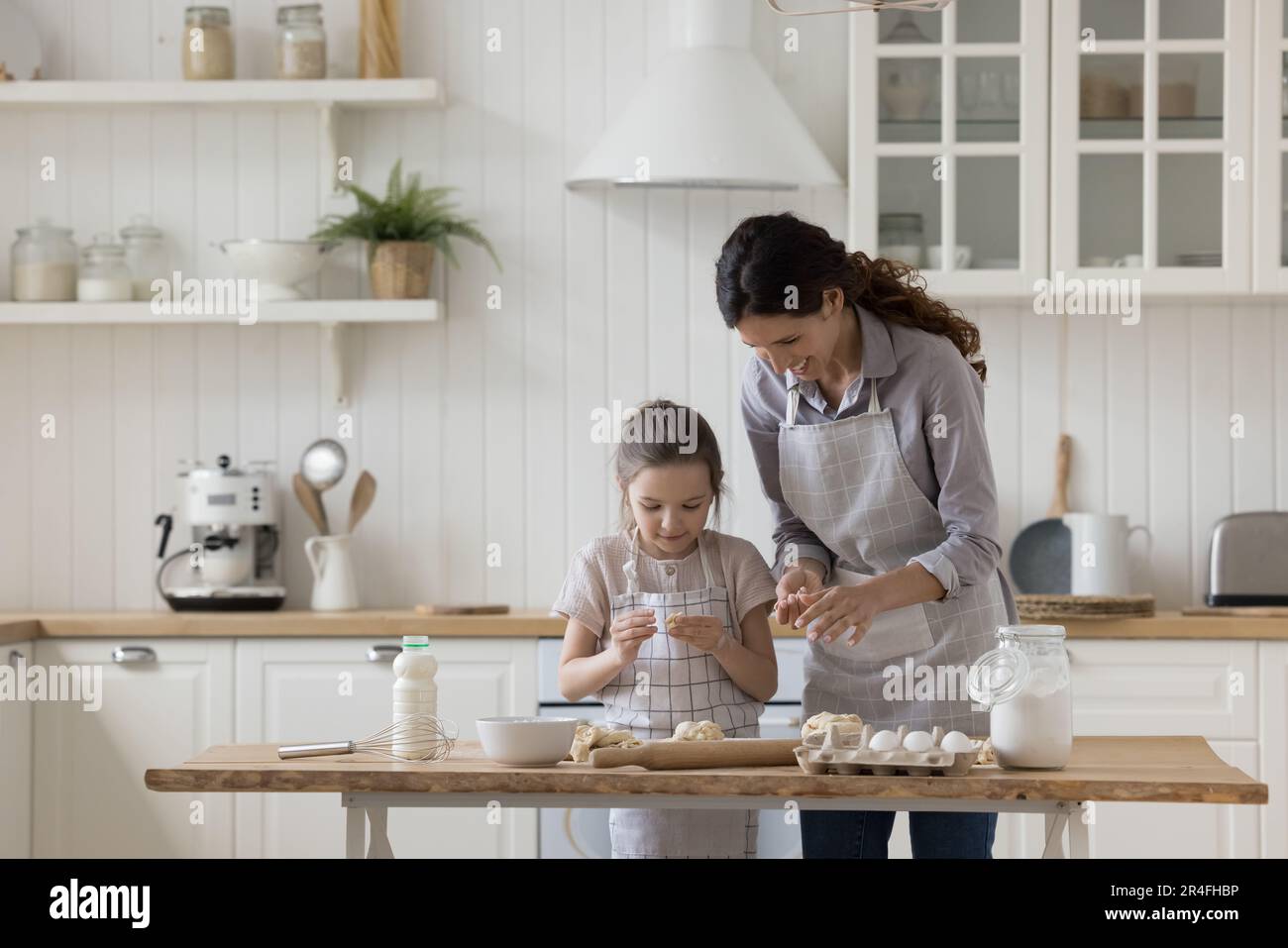 Happy mother and little preschool kid enjoying culinary hobby together ...