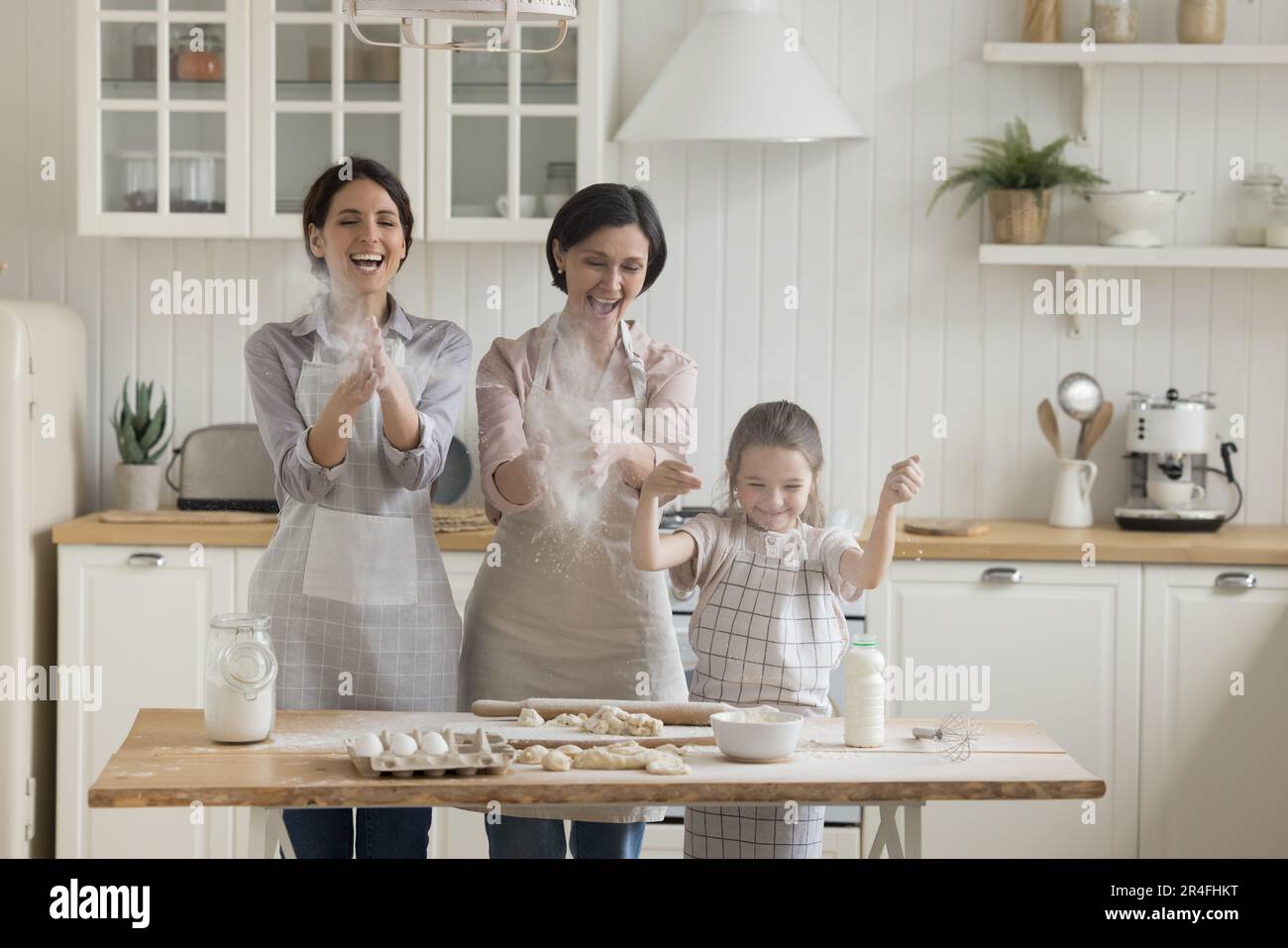 Excited girls and women of three family generations having fun Stock ...