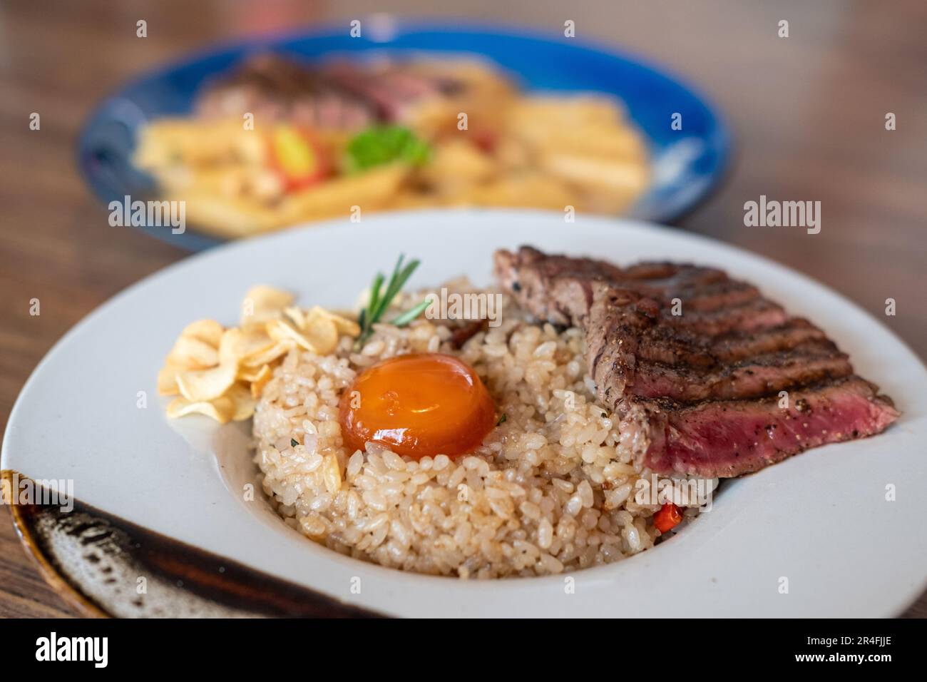 Beef with beef fat fried rice, a dish consisting of a bowl of rice ...