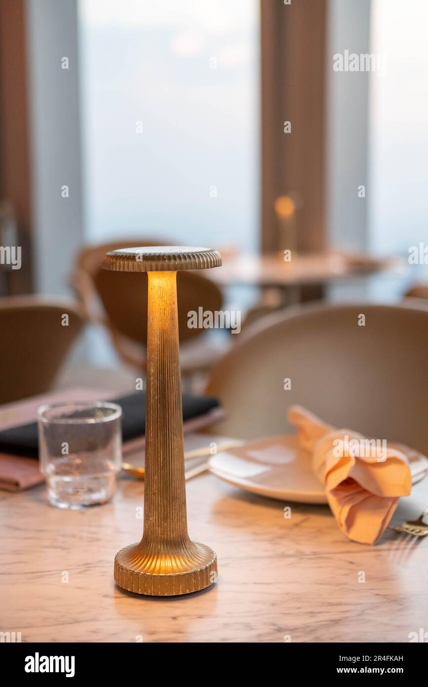 Table lamp on the table in fine dining restaurant Stock Photo - Alamy
