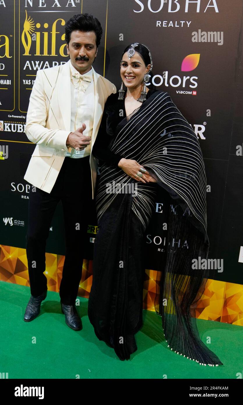 Bollywood actor Ritesh Deshmukh, left, and his wife actress Genelia ...
