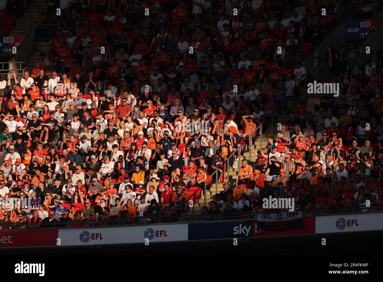 London, UK. 27th May, 2023. Luton fans highlighted by the sun at the ...