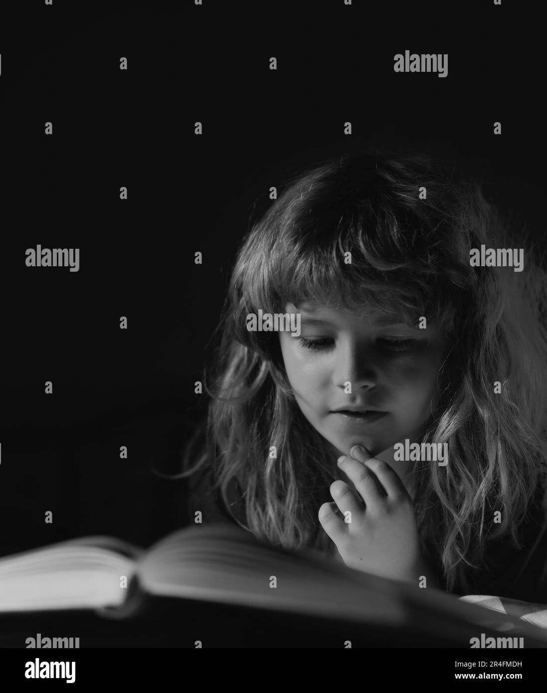 Child reading book. Kids read books. Little boy sitting on in living ...