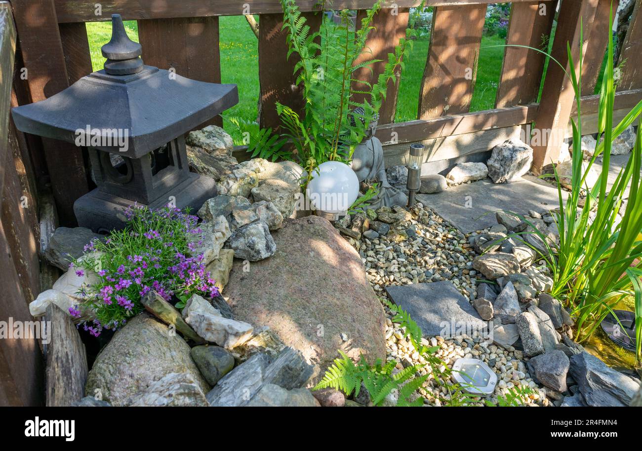 Japanese garden with stones and temple Stock Photo - Alamy