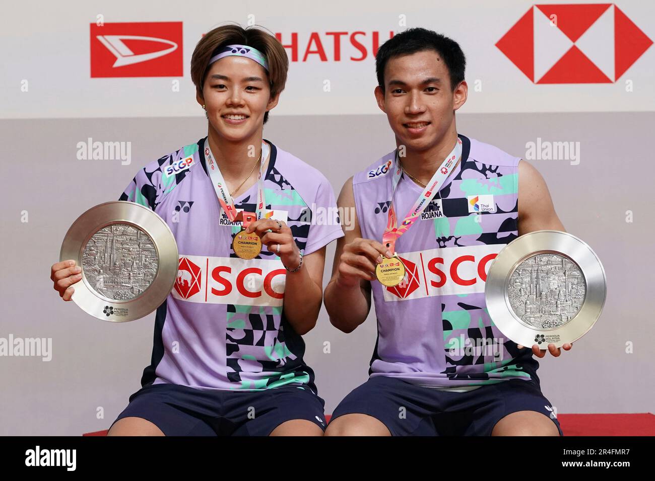 Thailand's Dechapol Puavaranukroh, right, and Sapsiree Taerattanachai pose for photo with their ...