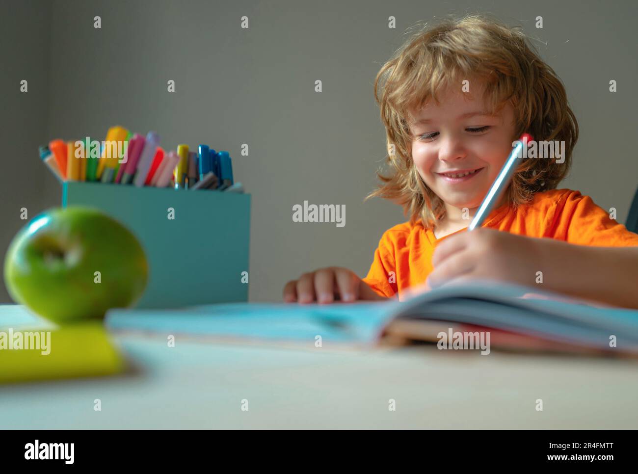 Little kid boy is doing his homework for elementary school Stock Photo ...